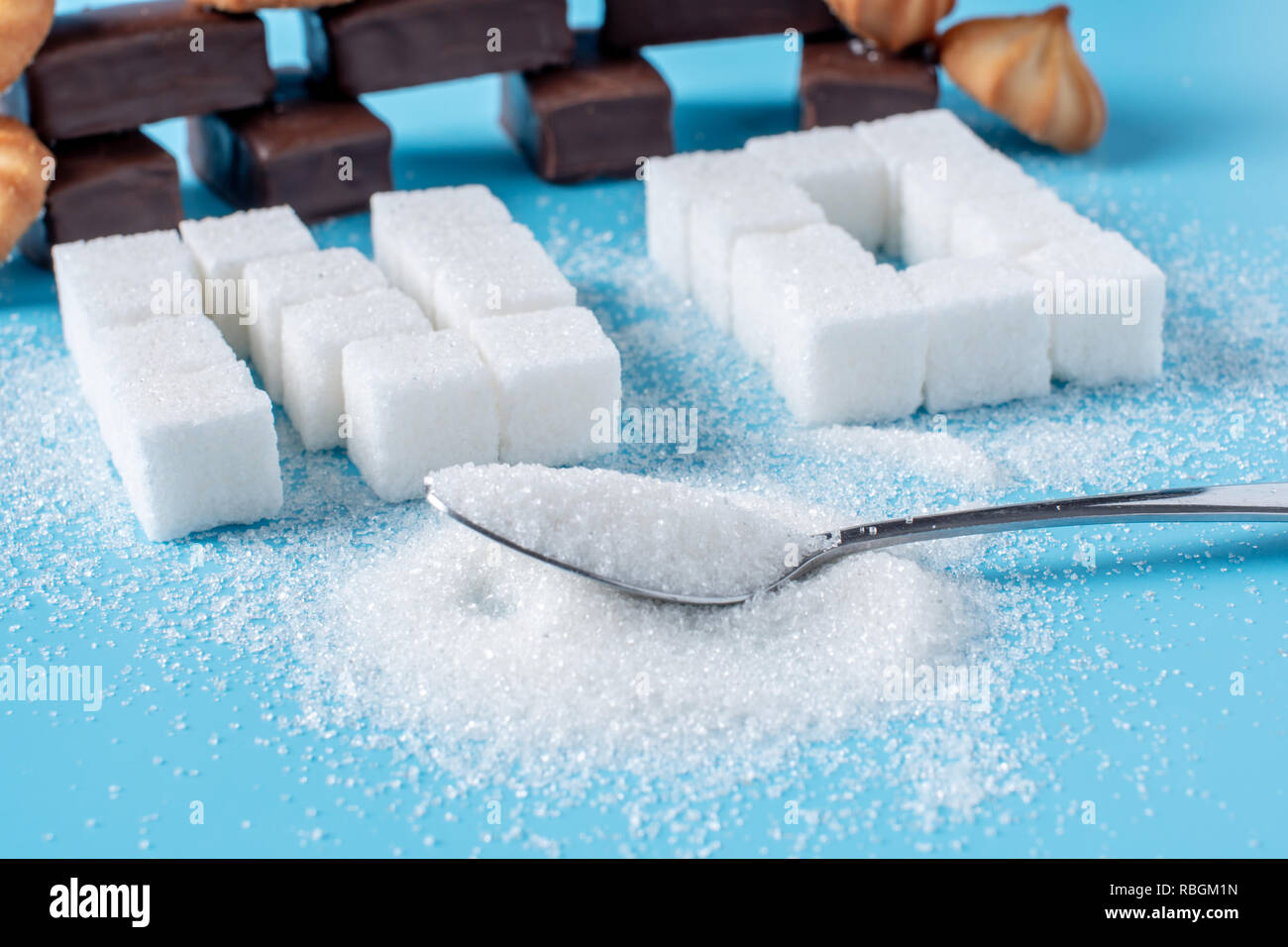 Text No is lined with sugar cubes with sweets and cookies. The concept ...