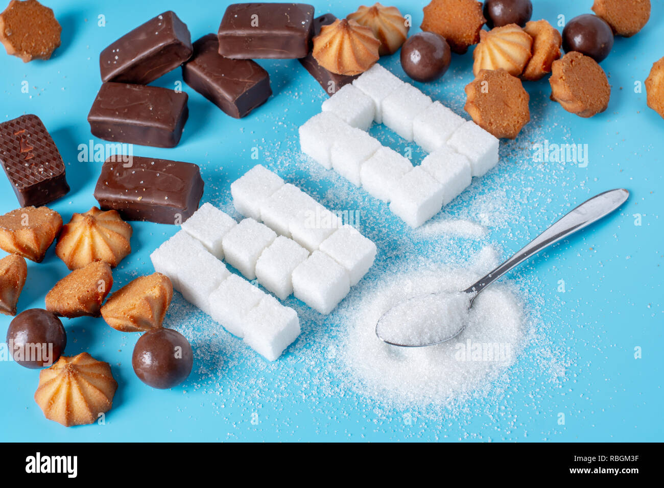 Text No is lined with sugar cubes with sweets and cookies. The concept ...