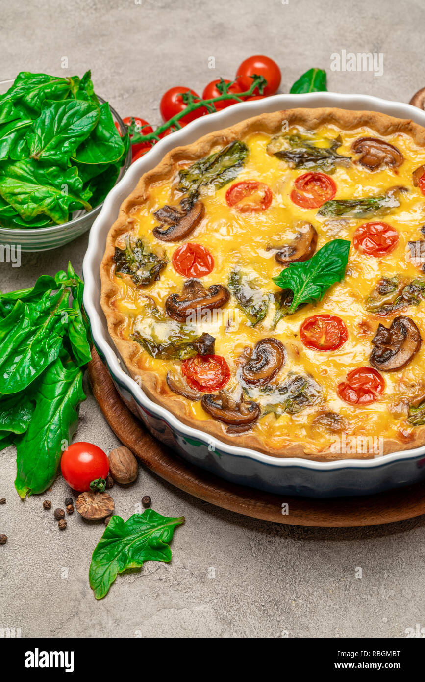 Baked homemade quiche pie in ceramic baking form Stock Photo - Alamy