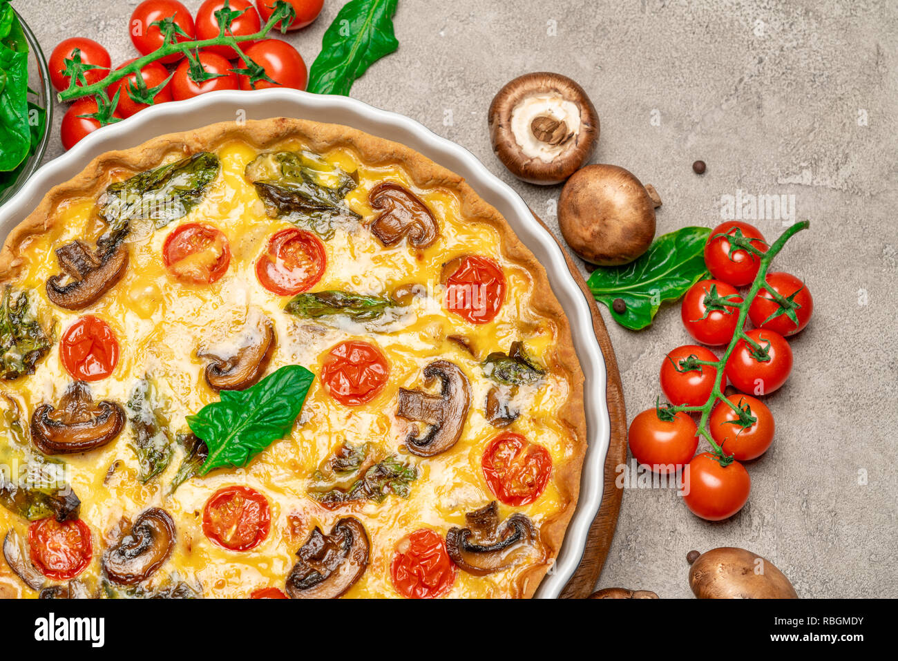 Baked homemade quiche pie in ceramic baking form Stock Photo - Alamy