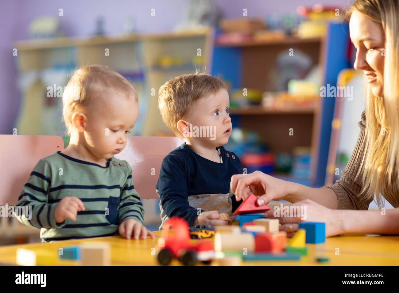 Children building blocks teacher hi-res stock photography and images ...