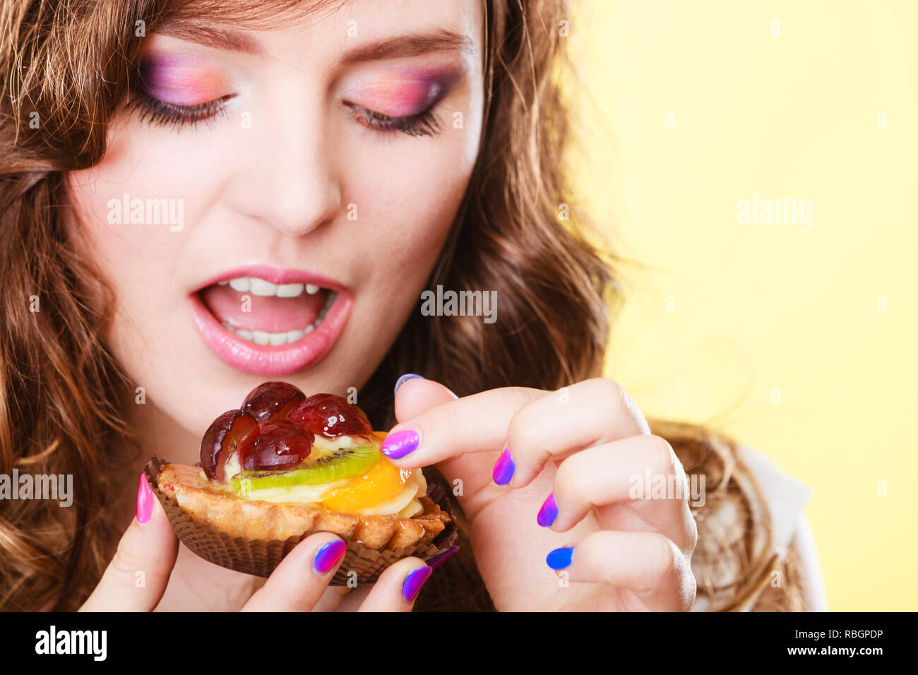 Bakery, sweet food and people concept. smiling cute woman curly hair ...