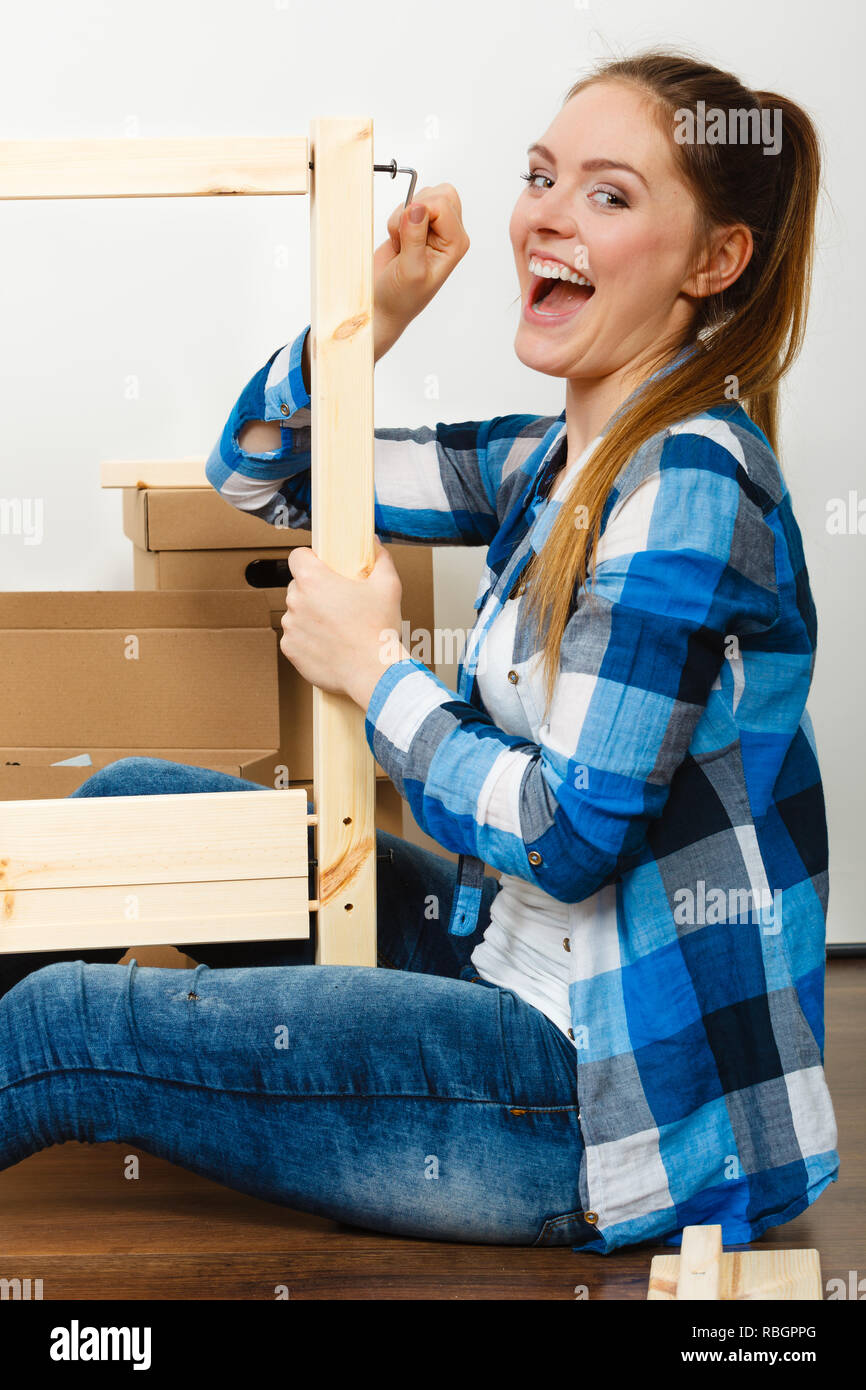 Woman Assembling Wooden Furniture Using Screwdriver Diy Enthusiast