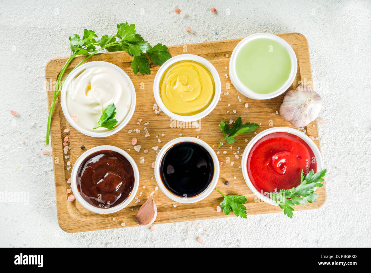 Set of classic sauces on white stone concrete stone background Stock ...