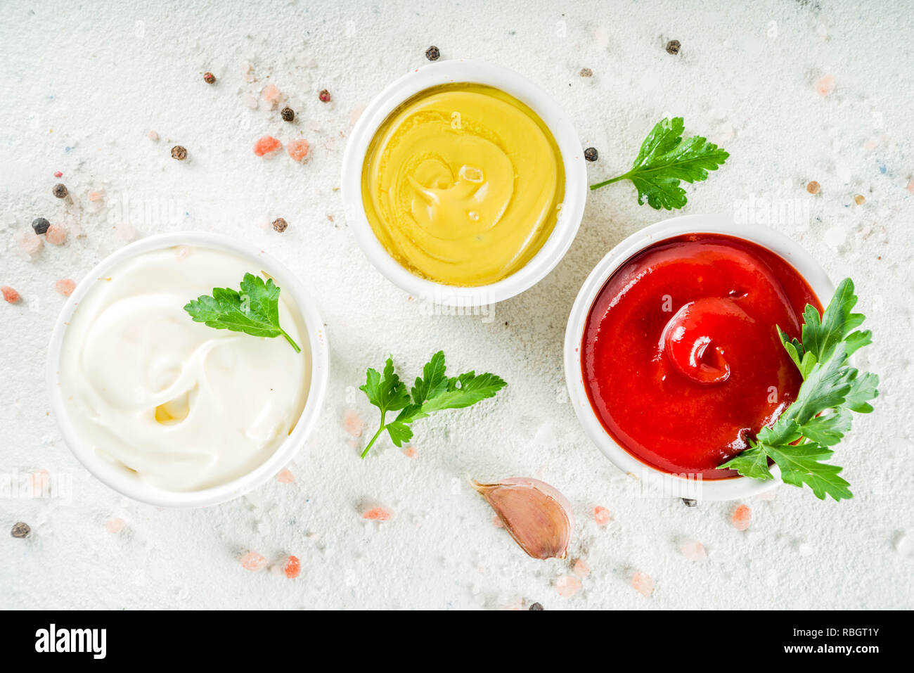 Set of classic sauces on white stone concrete stone background Stock ...