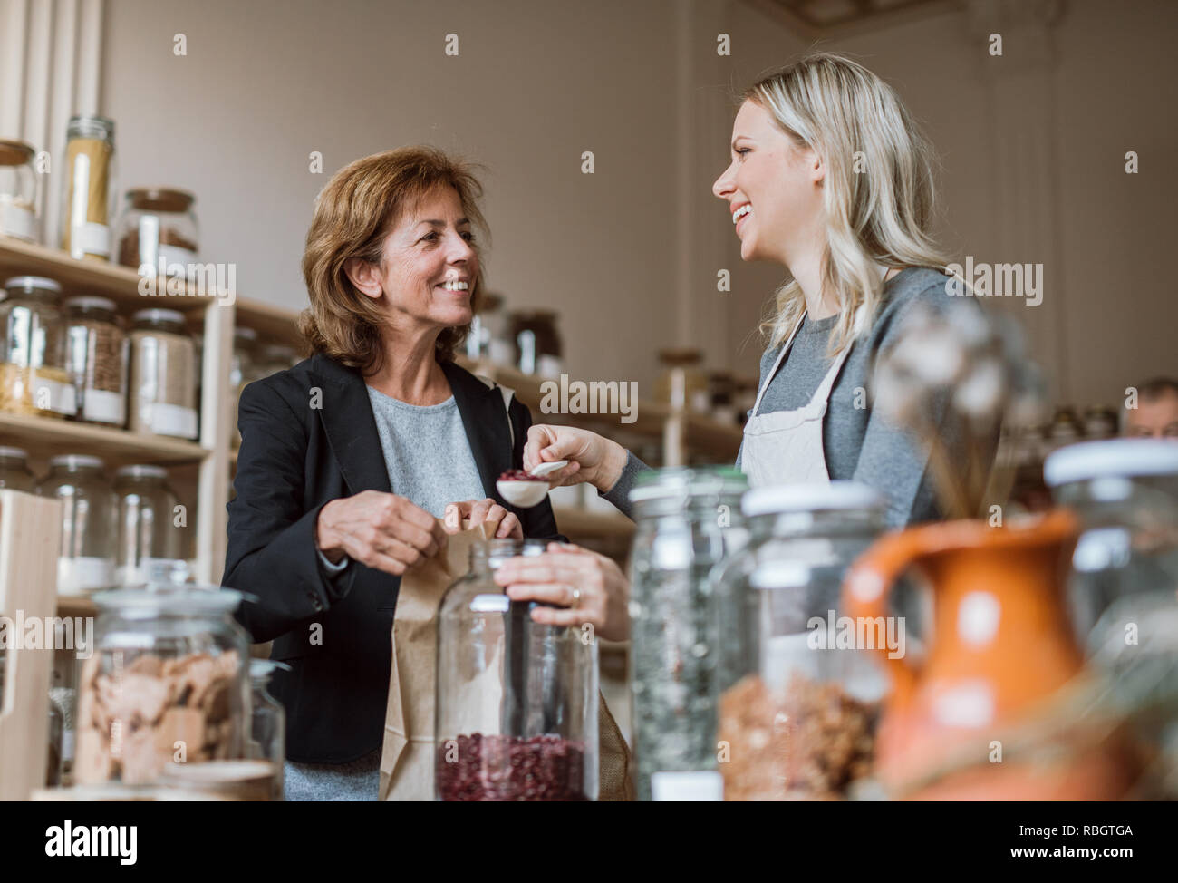 Shop assistant serving customer hi-res stock photography and images - Alamy