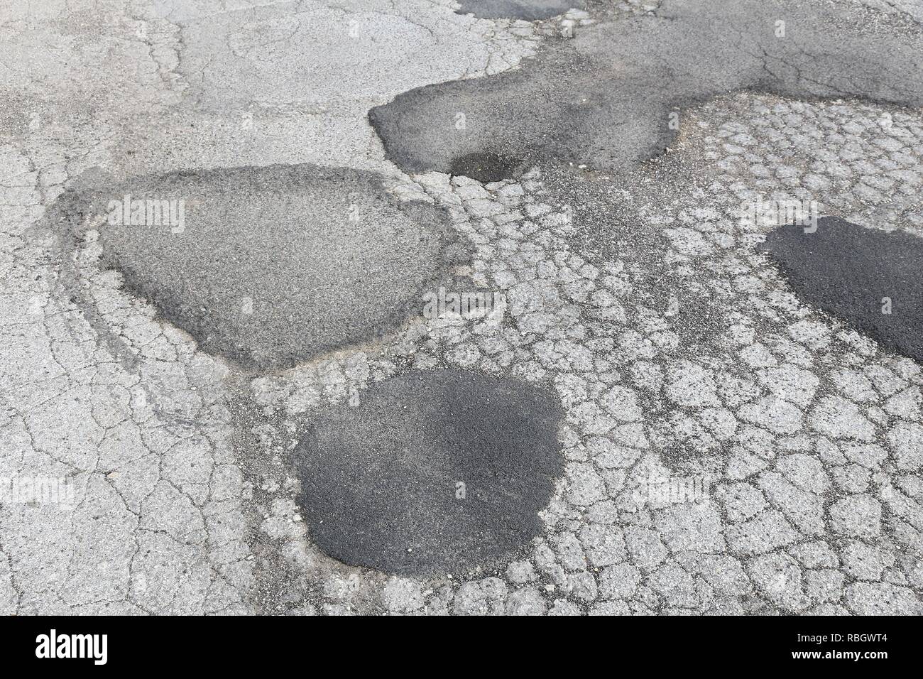 Road surface damage - bad maintenance quality. Asphalt cracks in Italy ...
