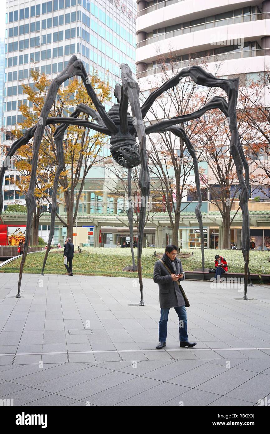 TOKYO, JAPAN - DECEMBER 1, 2016: People walk by Roppongi Hills spider ...