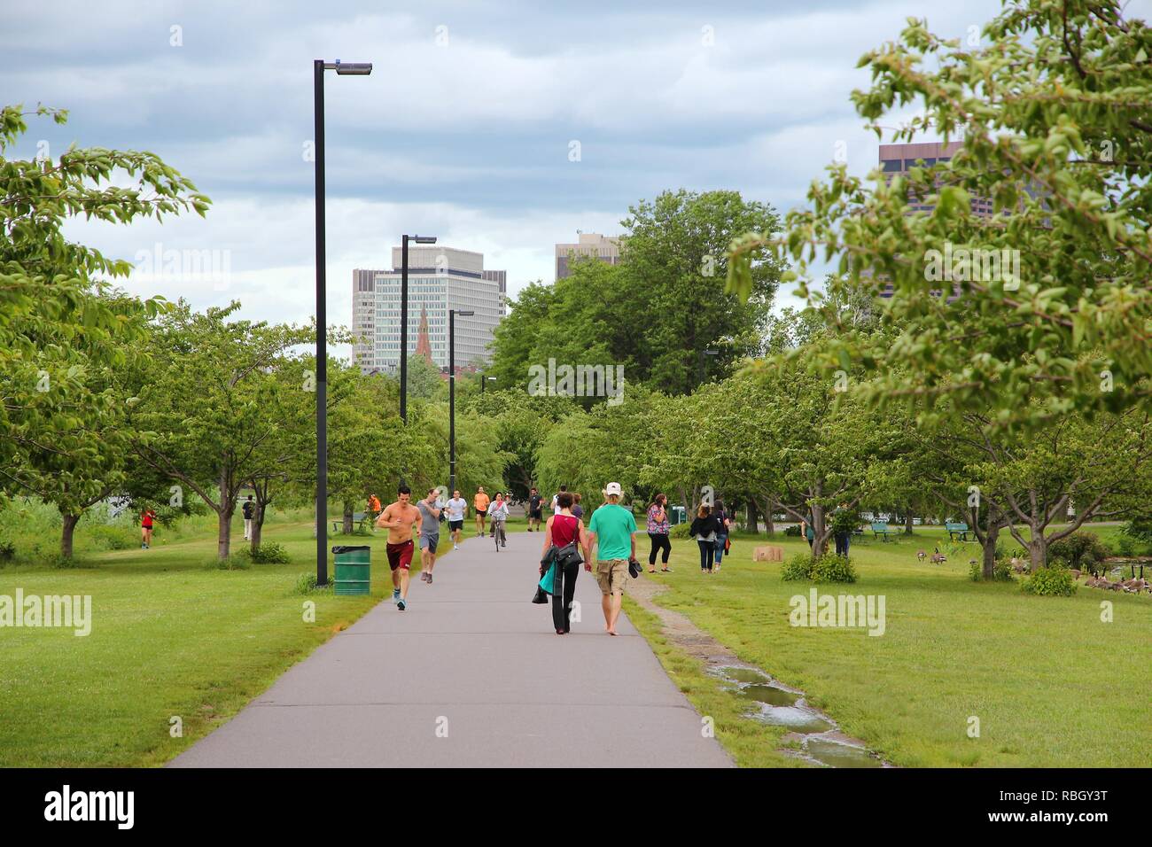 BOSTON, USA - JUNE 8, 2013: People visit Charles River esplanade park ...