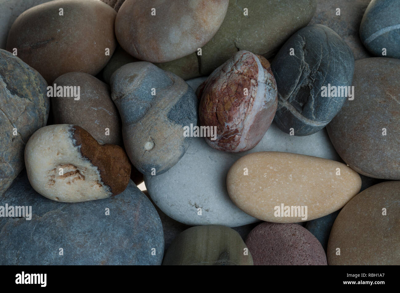Single grey pebble isolated on white Stock Photo - Alamy