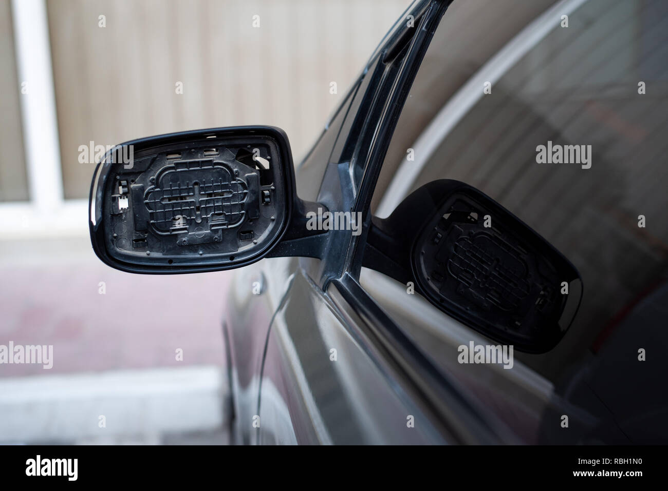 Car with broken rear mirror close up Stock Photo - Alamy