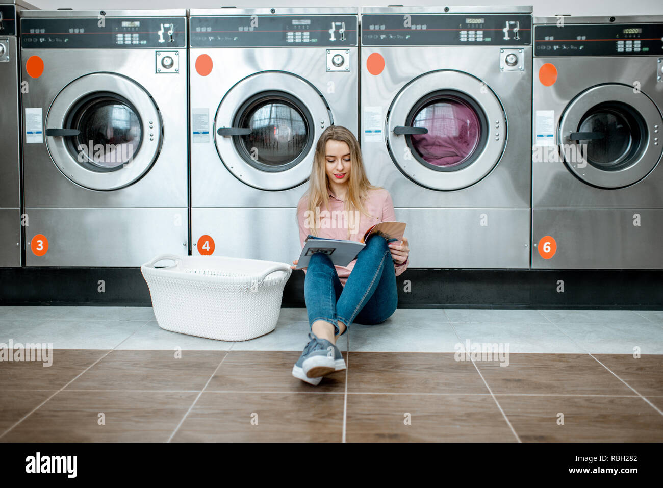 Woman Sitting On Washing Machine High Resolution Stock Photography and ...