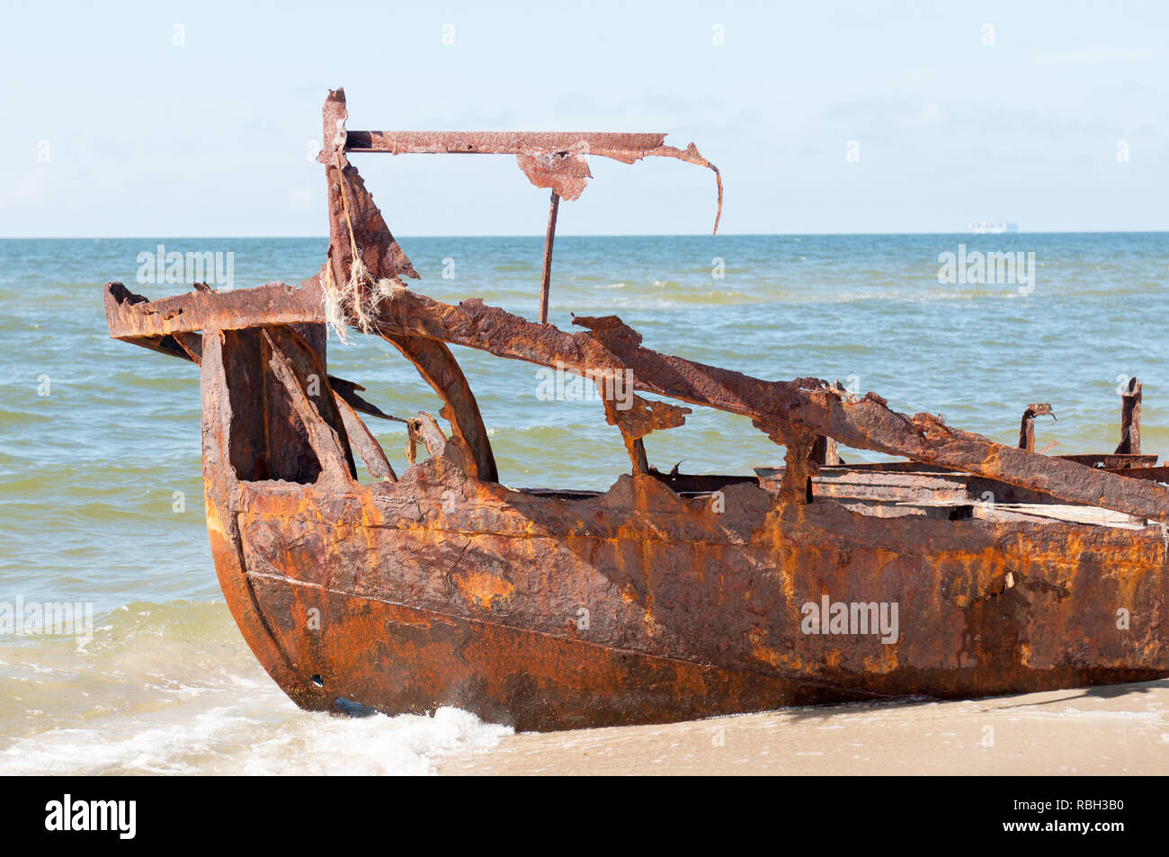 An old rusty ship. The Baltic Sea beach Stock Photo - Alamy