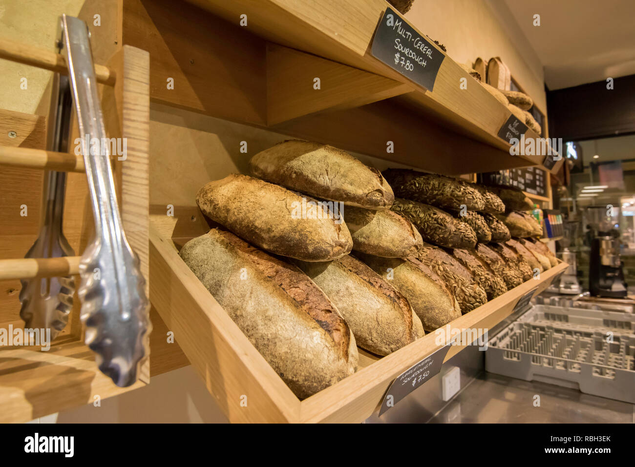Fresh sourdough bread stacked ready for sale in a Sydney, Australia ...