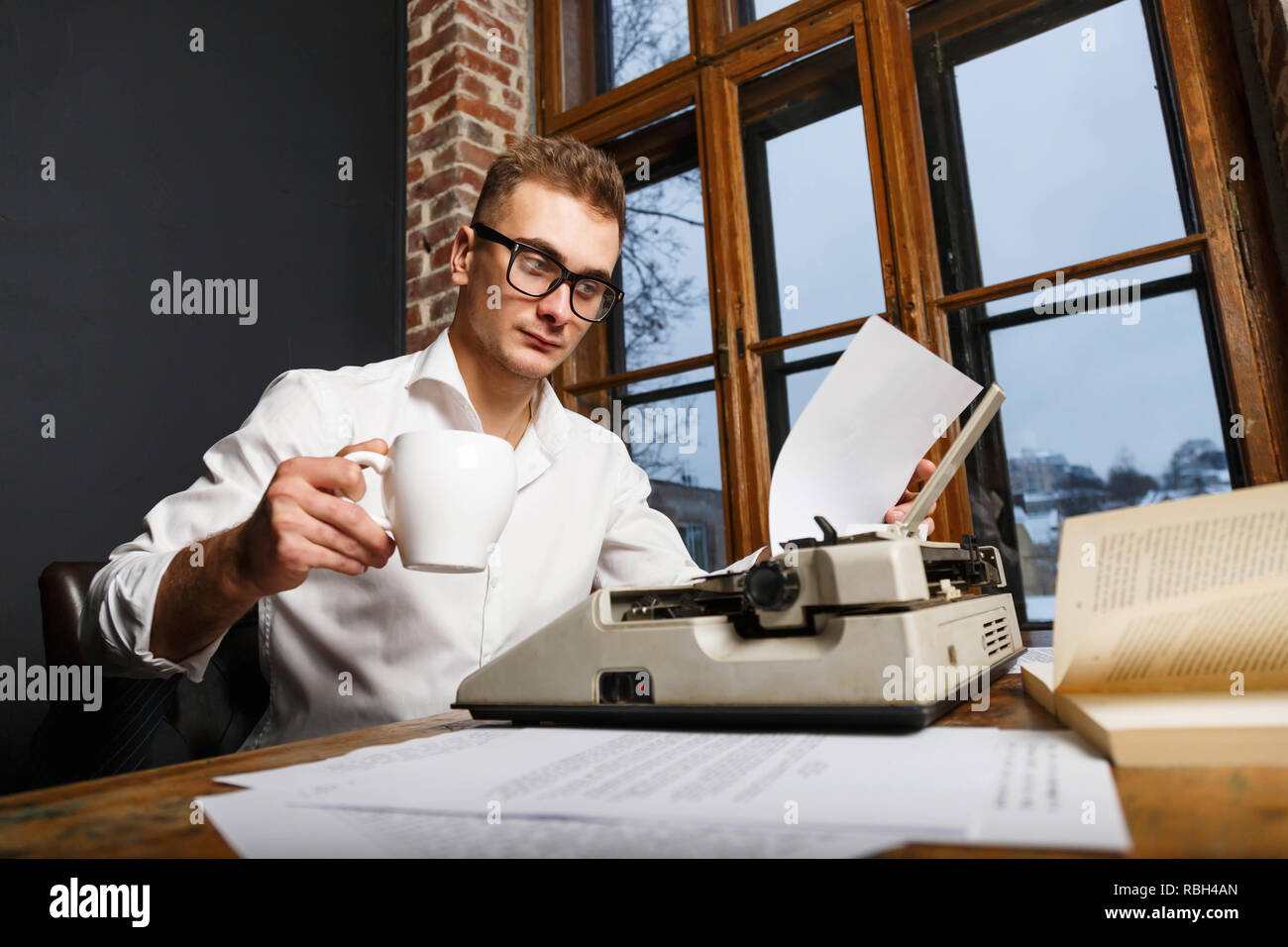 Man writing in vintage typewriter hi-res stock photography and images ...