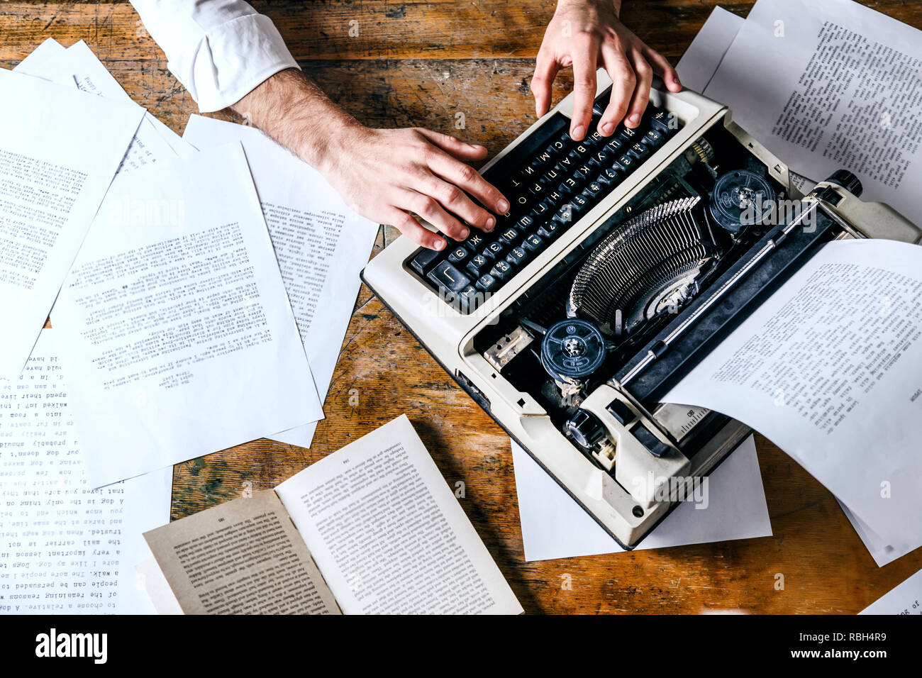 Young man's hands typing on an antique vintage typewriter Stock Photo ...