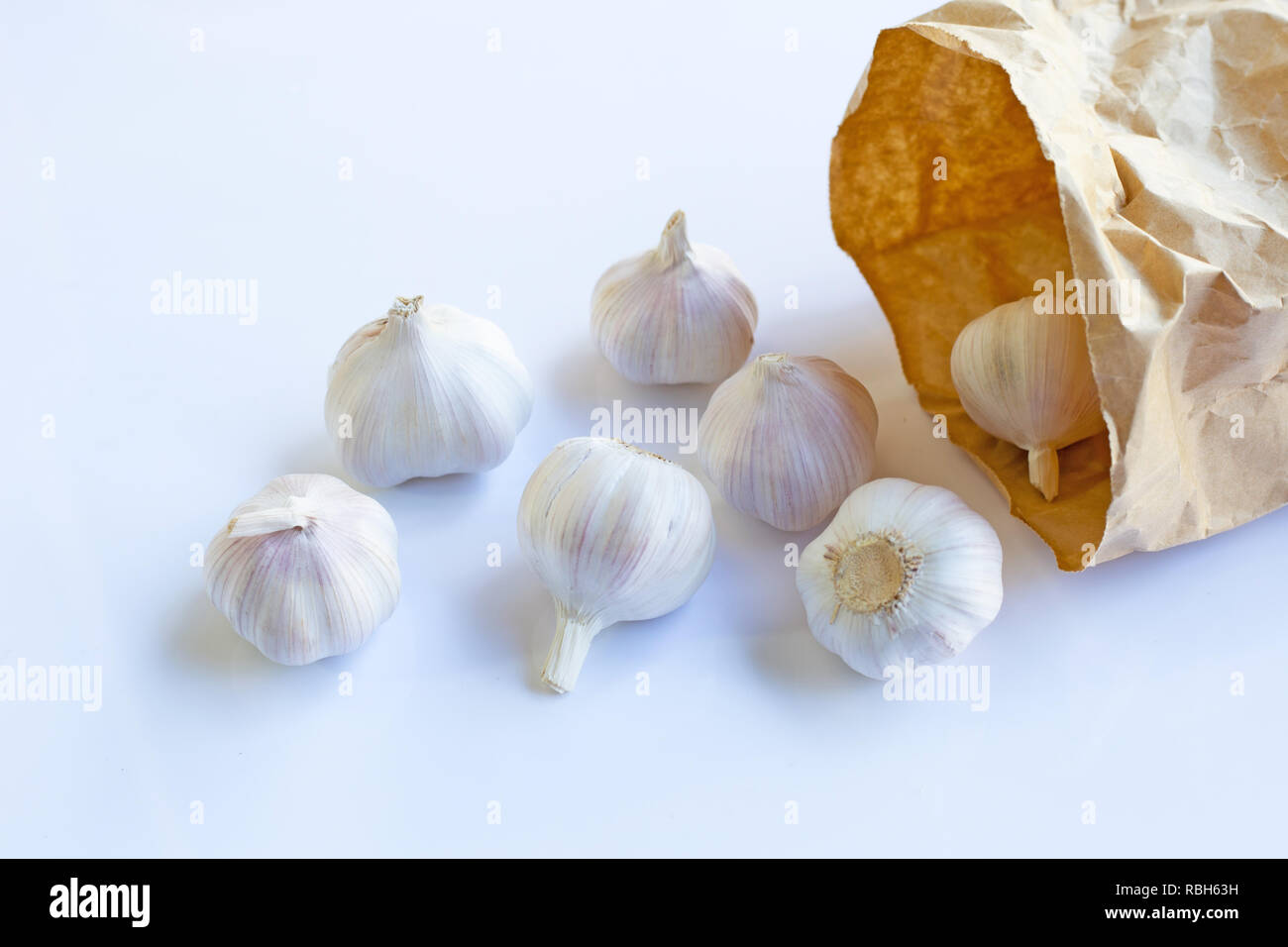 Garlic on white background Stock Photo - Alamy