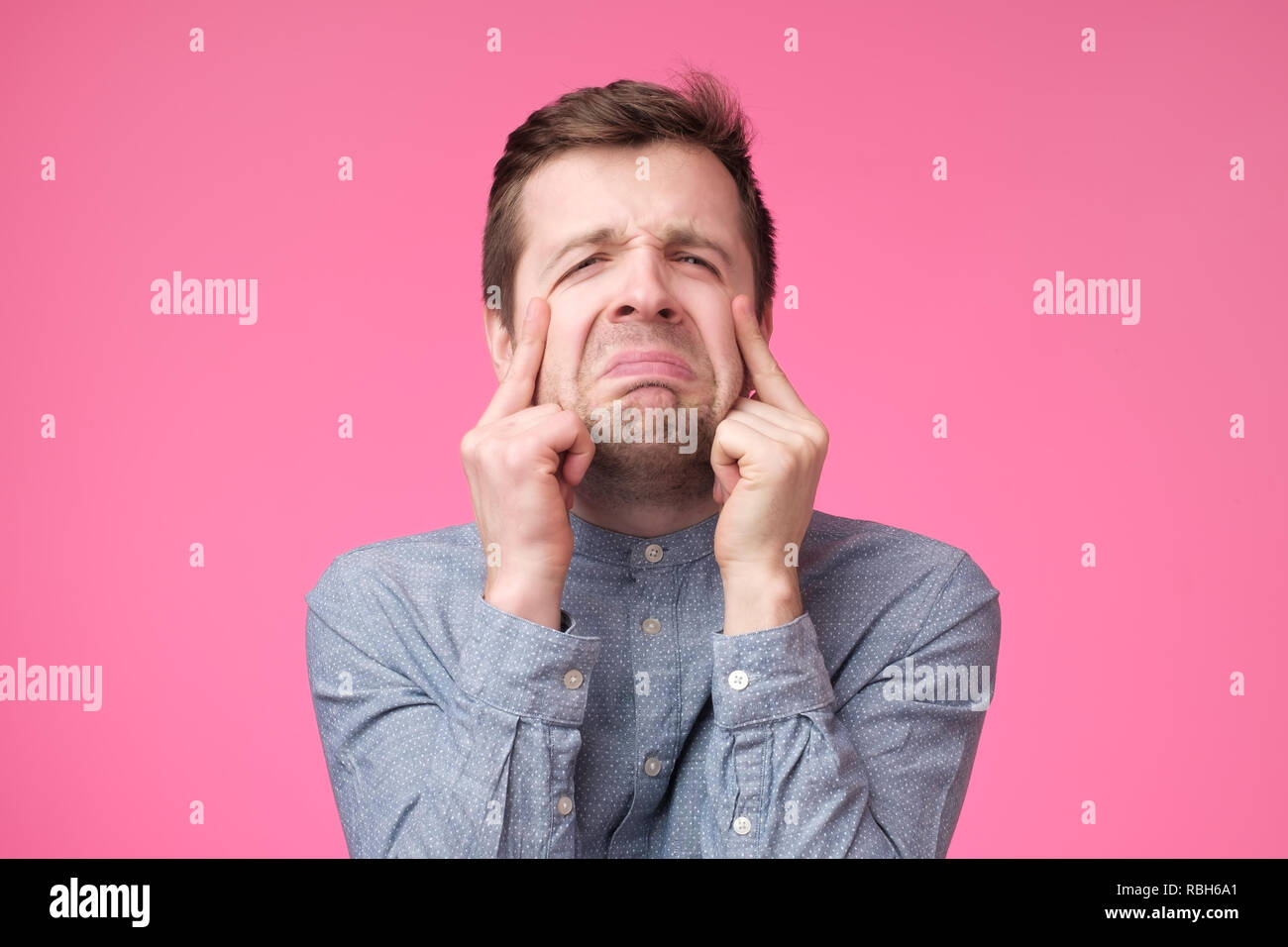 Young man crying tears hi-res stock photography and images - Alamy