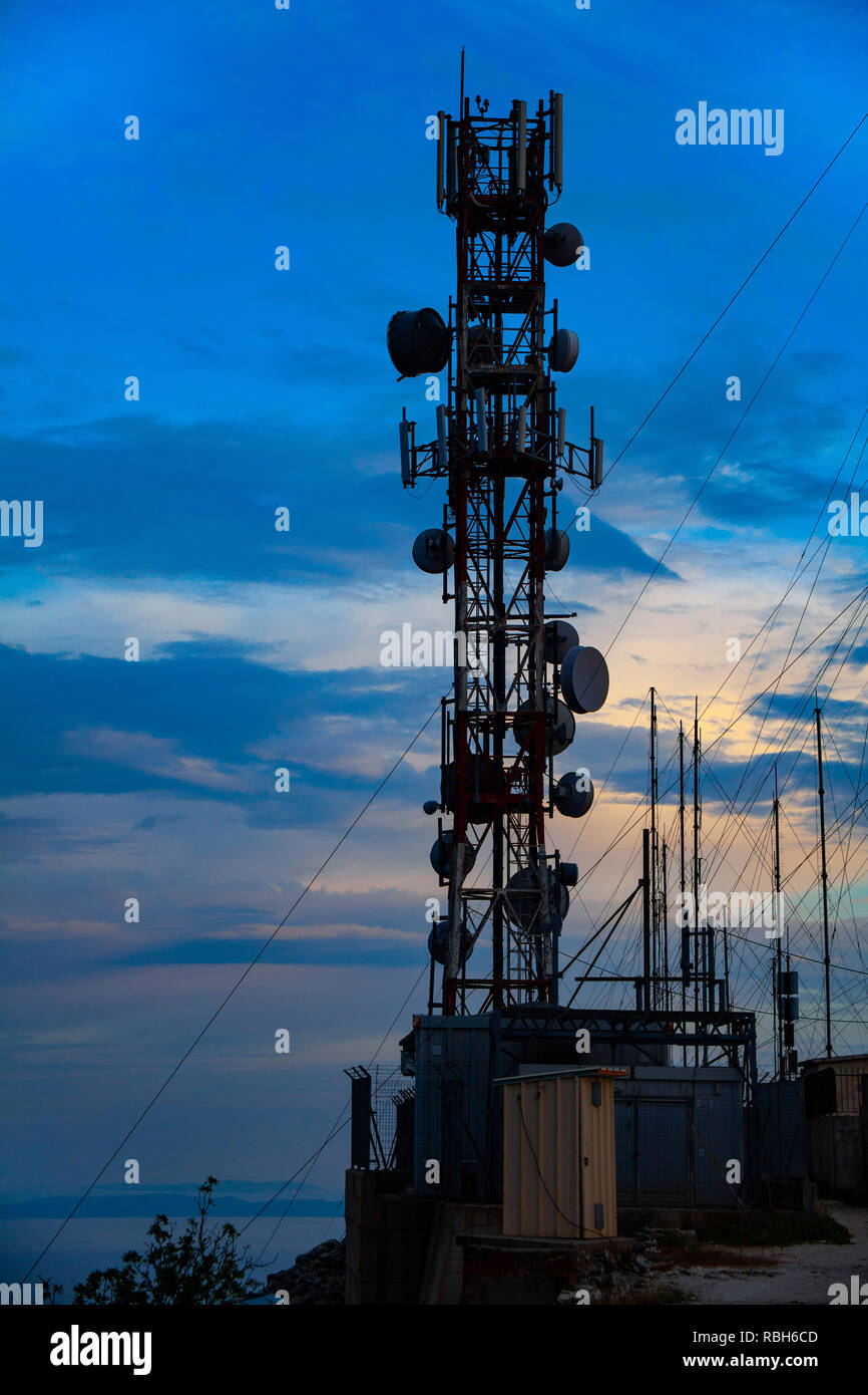 Transmission lines passing through broadcast tower. Satellite disk ...