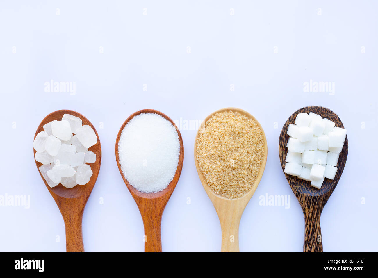 Various types of sugar on white background Stock Photo - Alamy