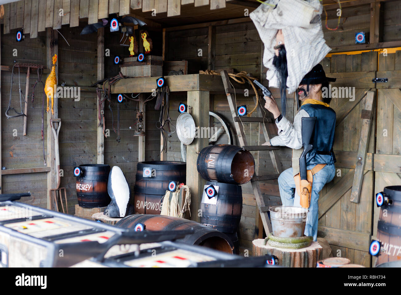Amusement Park Arcade Target Shooting for Fun. Cowboy Themed Items are ...
