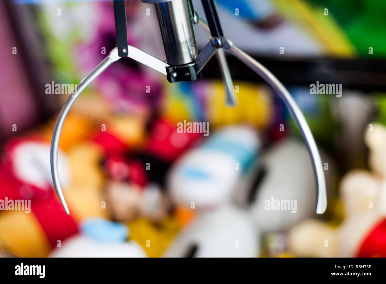 Closeup Shot of Slot Machine Toy Crane in Amusement Park. Electronic ...