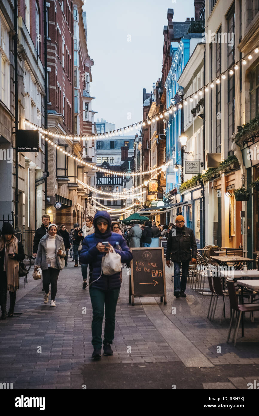 London, UK - January 5, 2019: People walking under the strings of ...