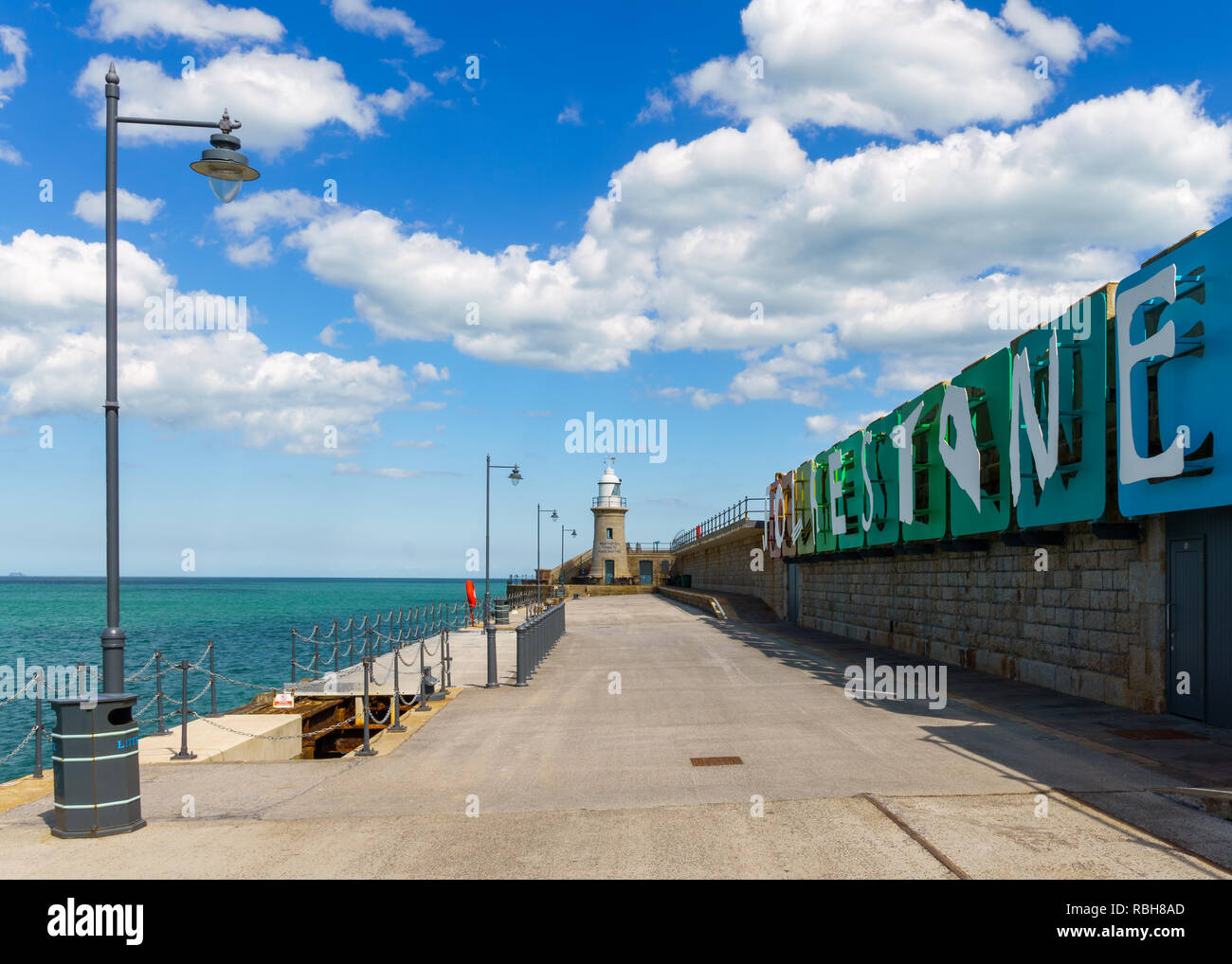 Folkestone Harbour, Lighthouse and Sign on a sunny summers day Stock ...