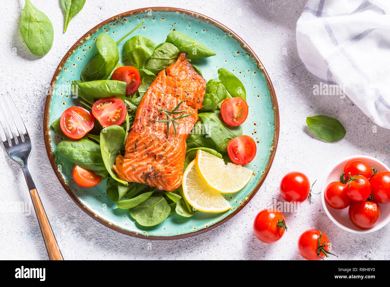 Baked salmon fish fillet with fresh salad top view on white Stock Photo ...