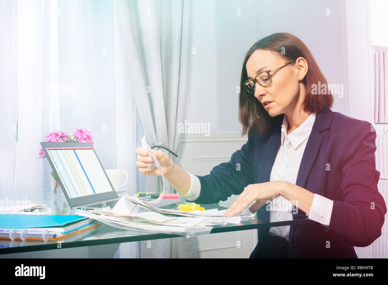 Business woman doing paperwork in the office Stock Photo - Alamy