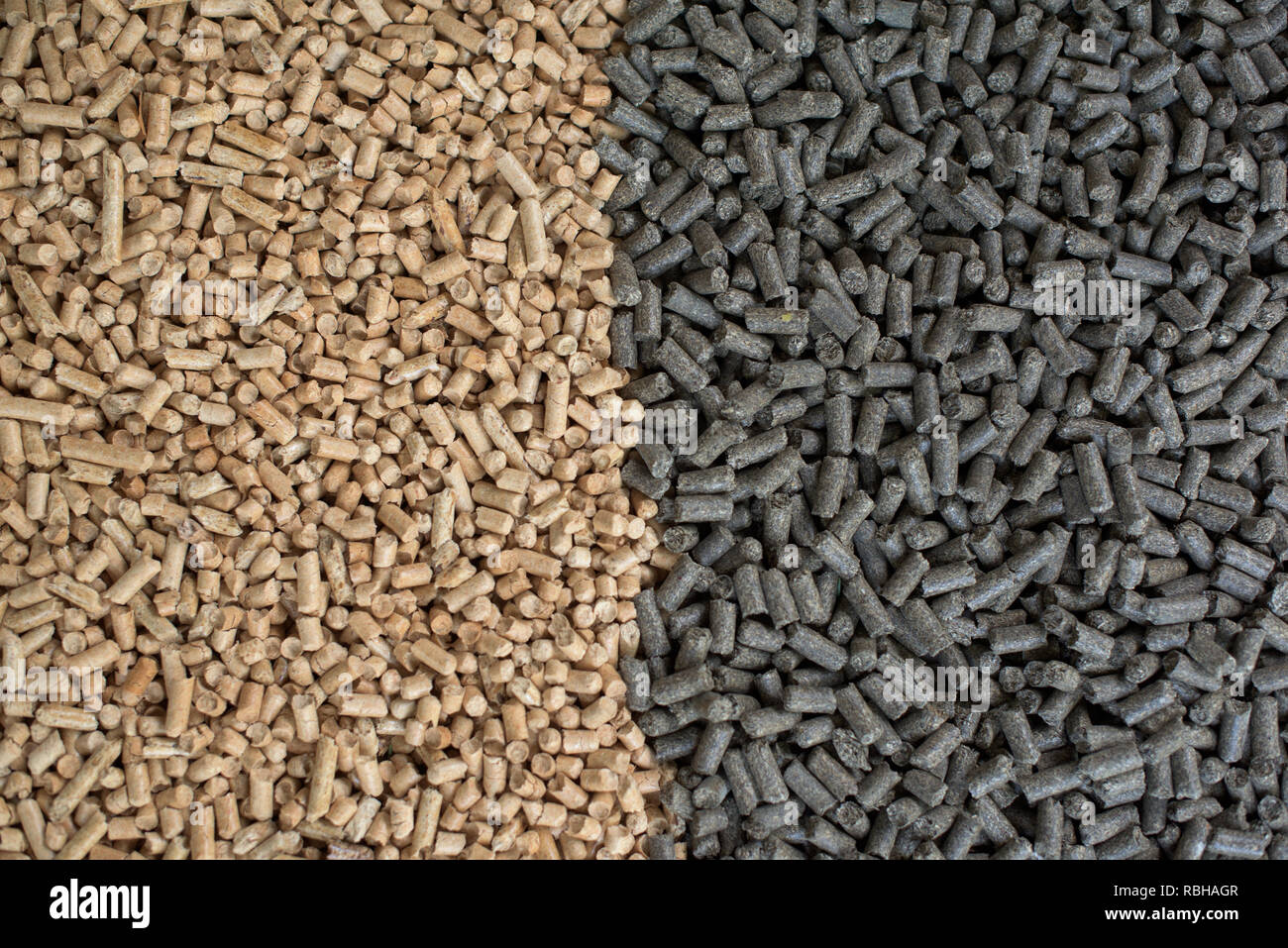 Two different kind of wooden pellets - made of pine and sunflower Stock ...