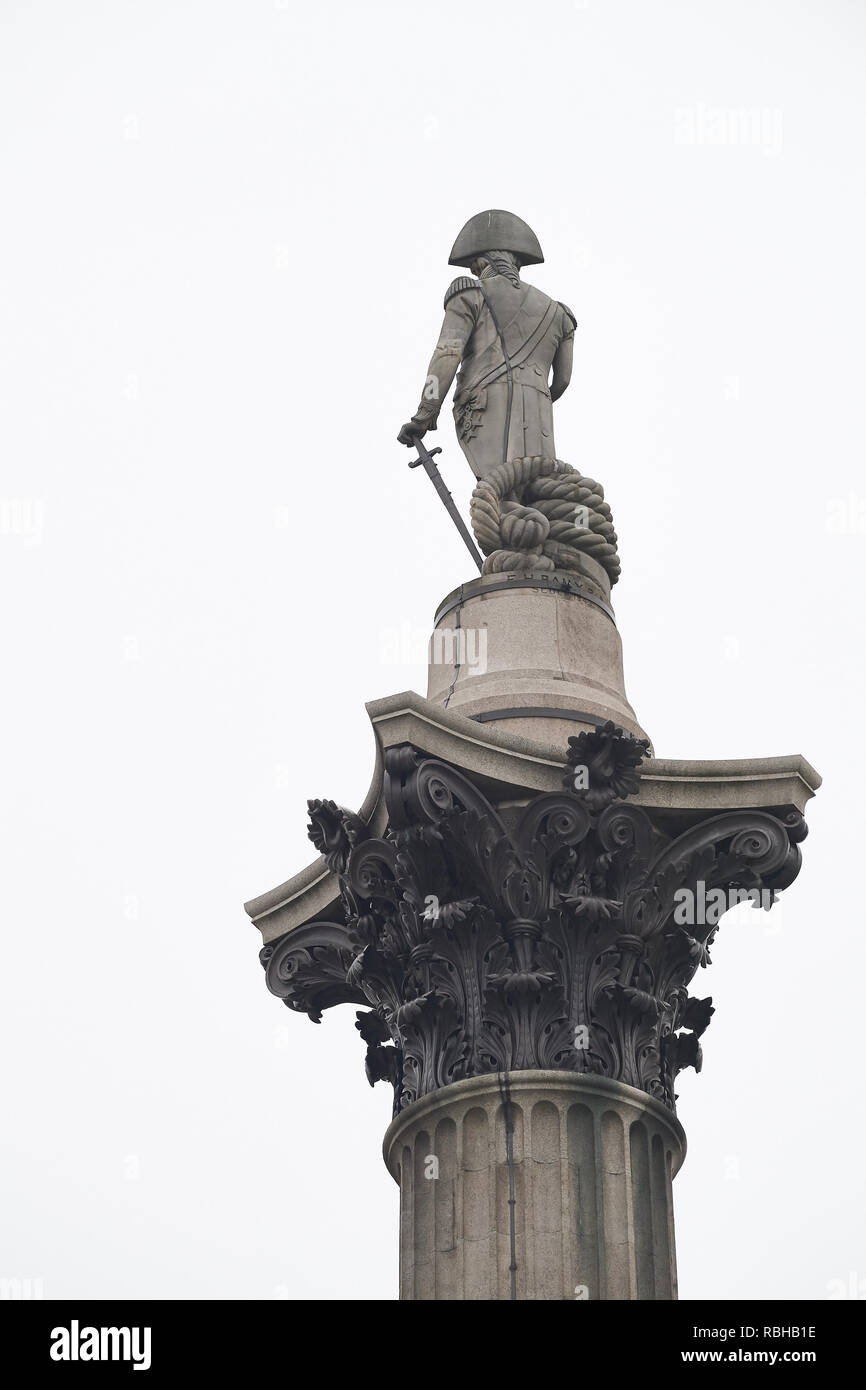 Statue of Admiral Nelson, in naval uniform and with sword, atop the ...