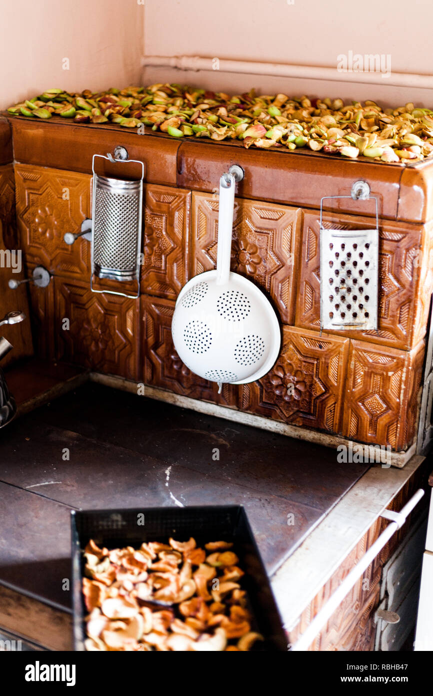 Kitchen on the old traditional way. Old teapot on the stove. Kitchen ...