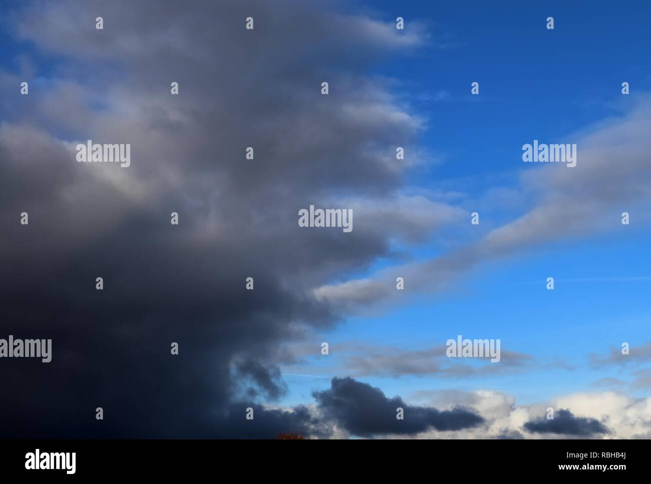 Dramatic and cloudy sky with some blue elements Stock Photo - Alamy