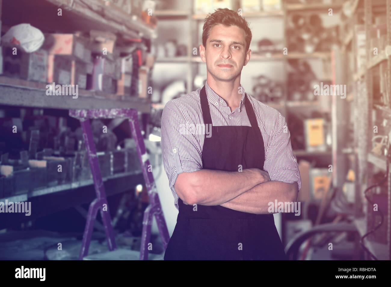 Portrait of serios adult man in uniform who is standing on his ...