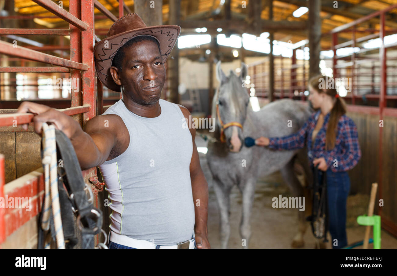 Couple working in stable hi-res stock photography and images - Alamy