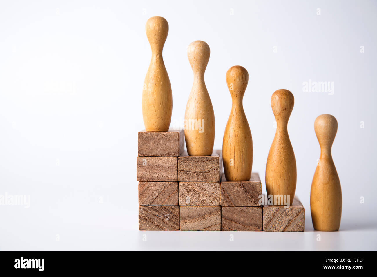 Business leadership concept. Wooden figures on blocks Stock Photo - Alamy