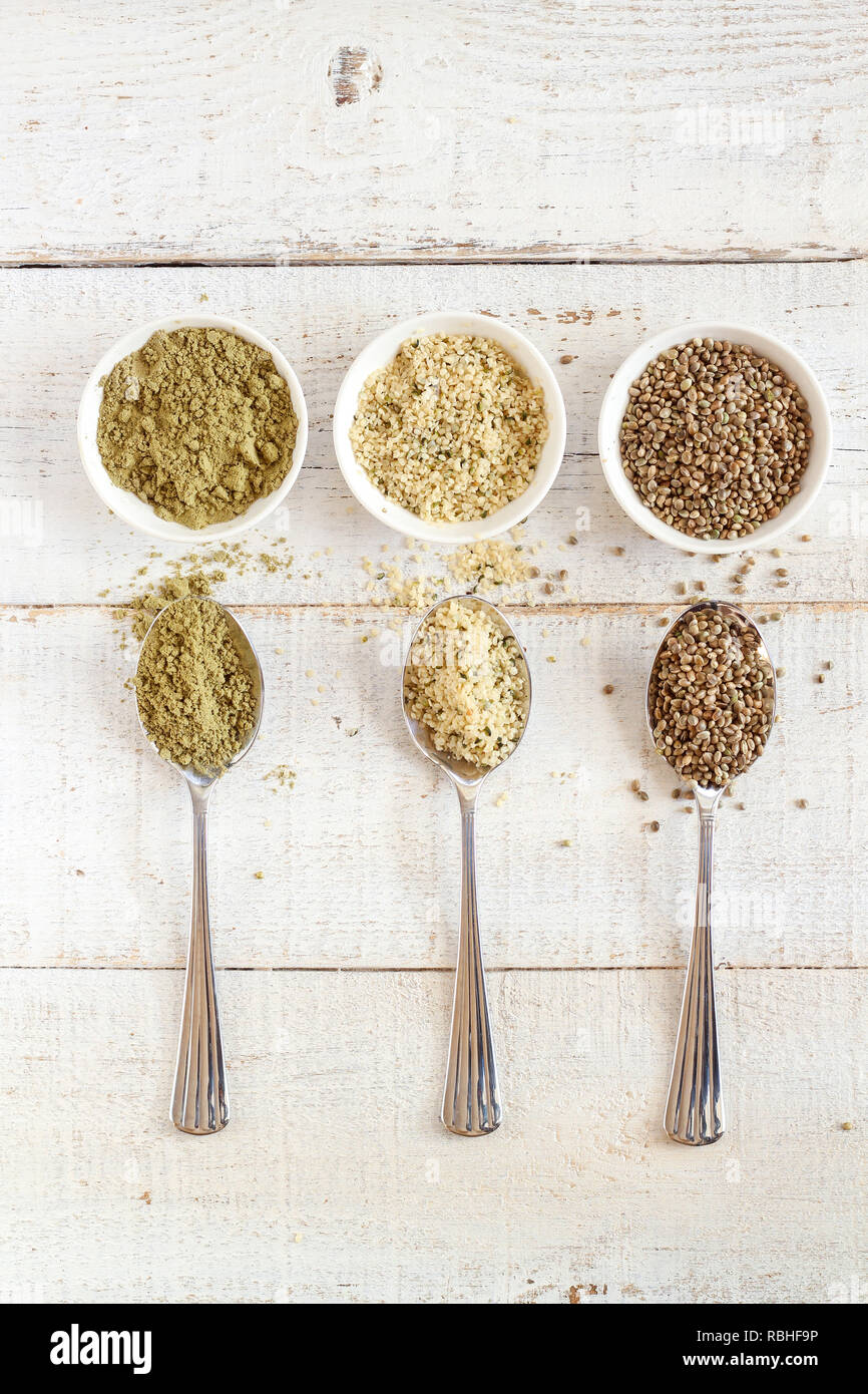 Organic hemp whole seeds, hulled seeds and protein powder in bowls and ...