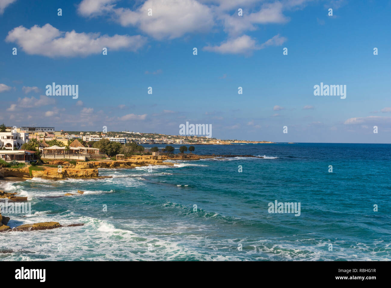 View to the west at the coastline down the little village (Limenas ...