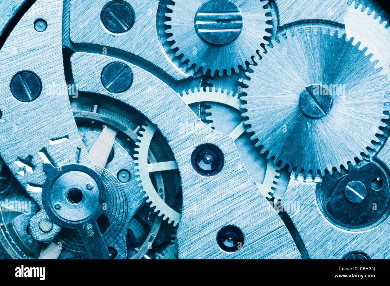 Close up view of watch mechanism in blue tones Stock Photo - Alamy