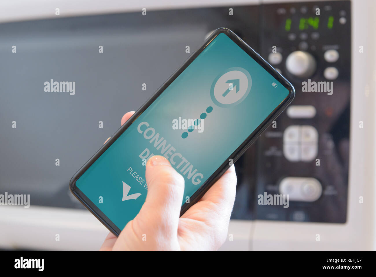 Connecting microwave oven with smart phone. Smart home and Internet of ...