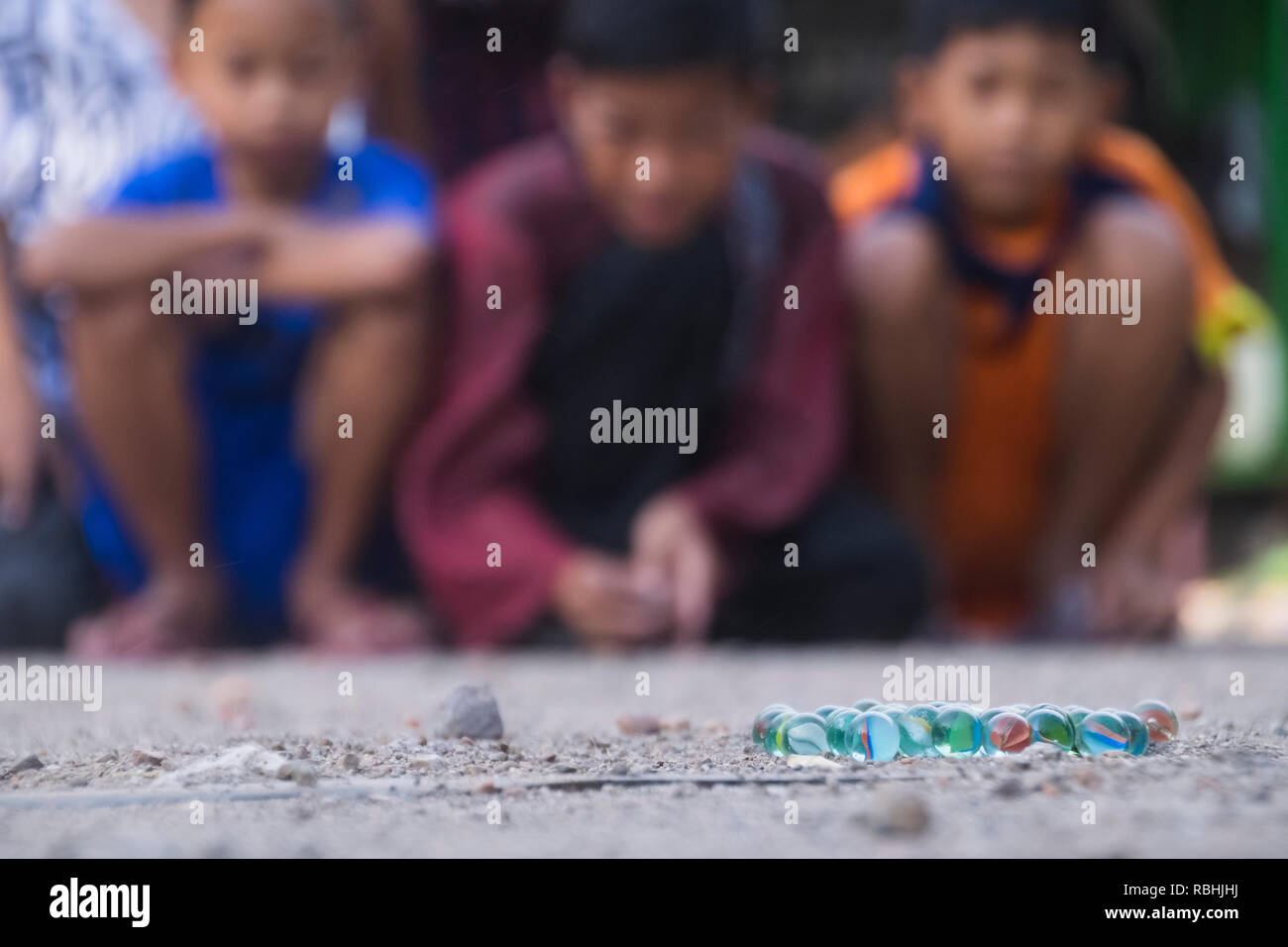 Playing marbles hi-res stock photography and images - Alamy