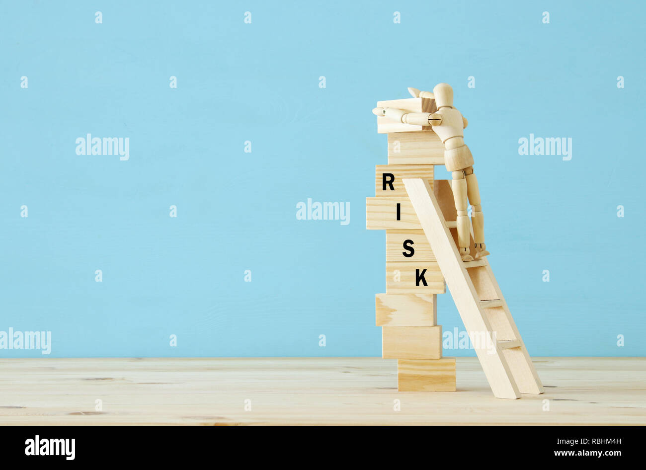 wooden dummy climbs a dangerously unstable structure and risks falling ...