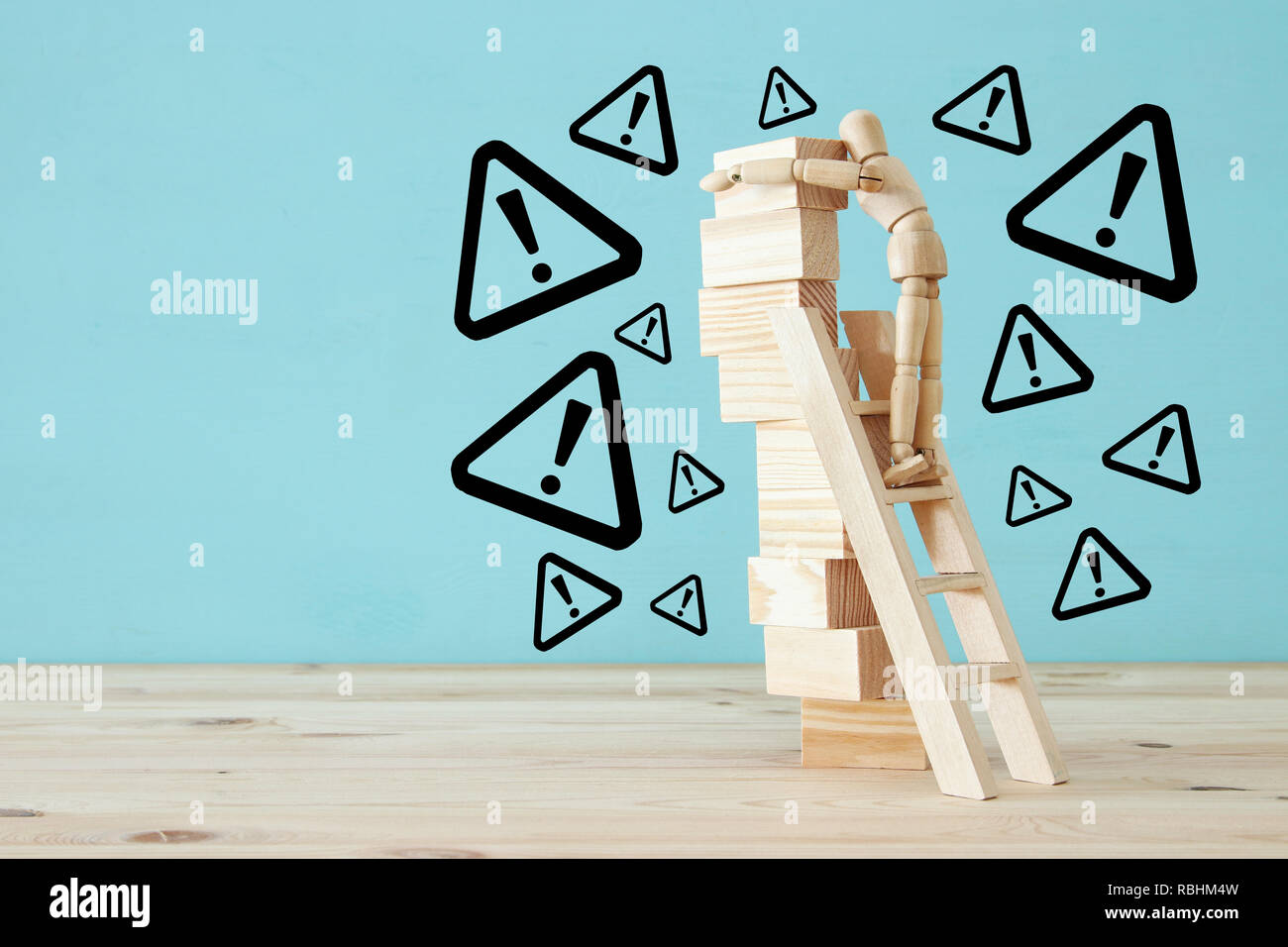 wooden dummy climbs a dangerously unstable structure and risks falling ...