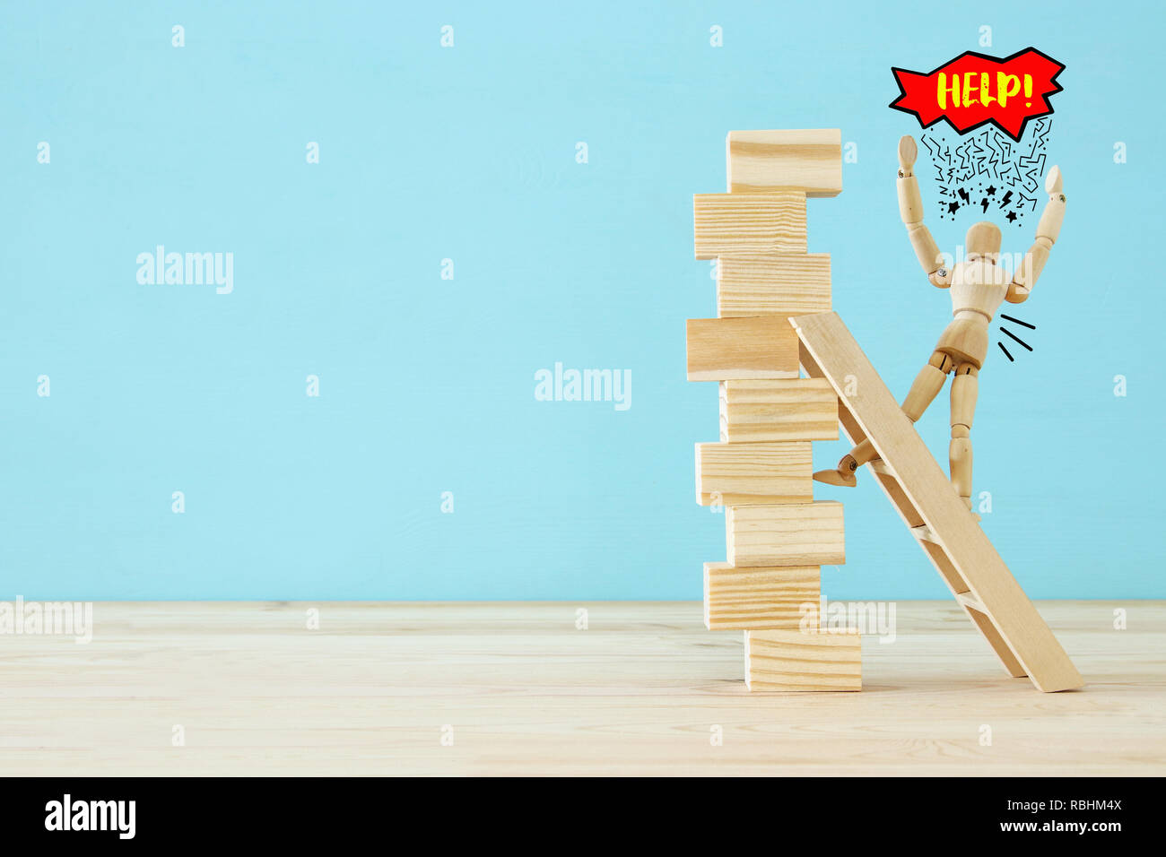wooden dummy climbs a dangerously unstable structure and risks falling ...