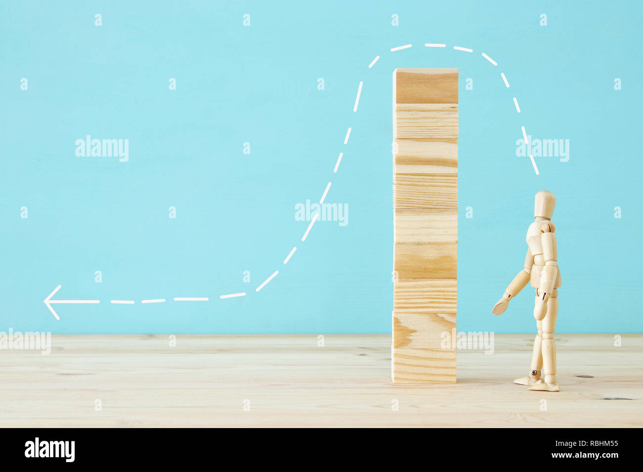 concept photo of obstacles overcoming, wooden dummy looking at a ...