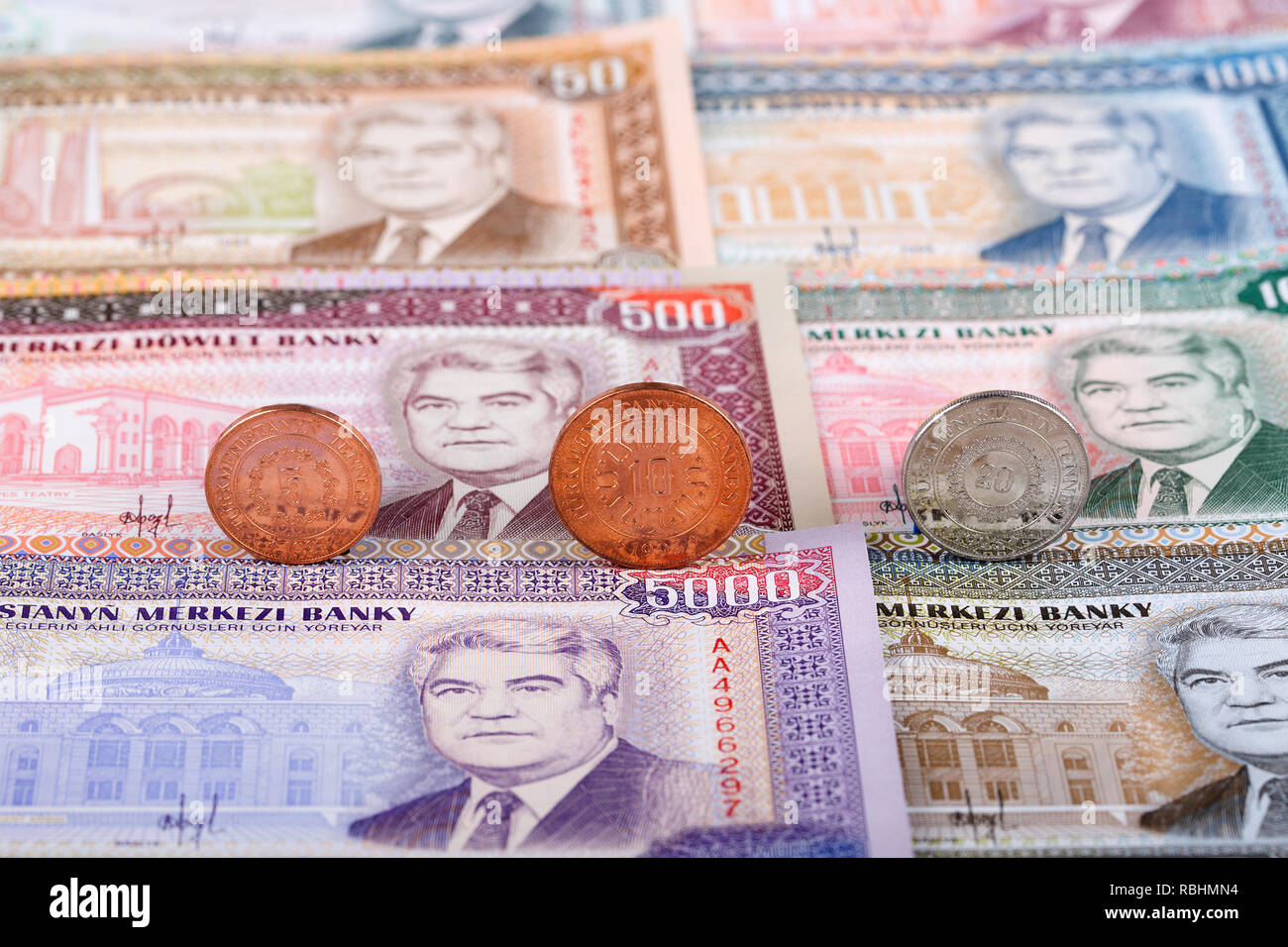 Turkmenistan Tenge coins on the background of banknotes Stock Photo - Alamy