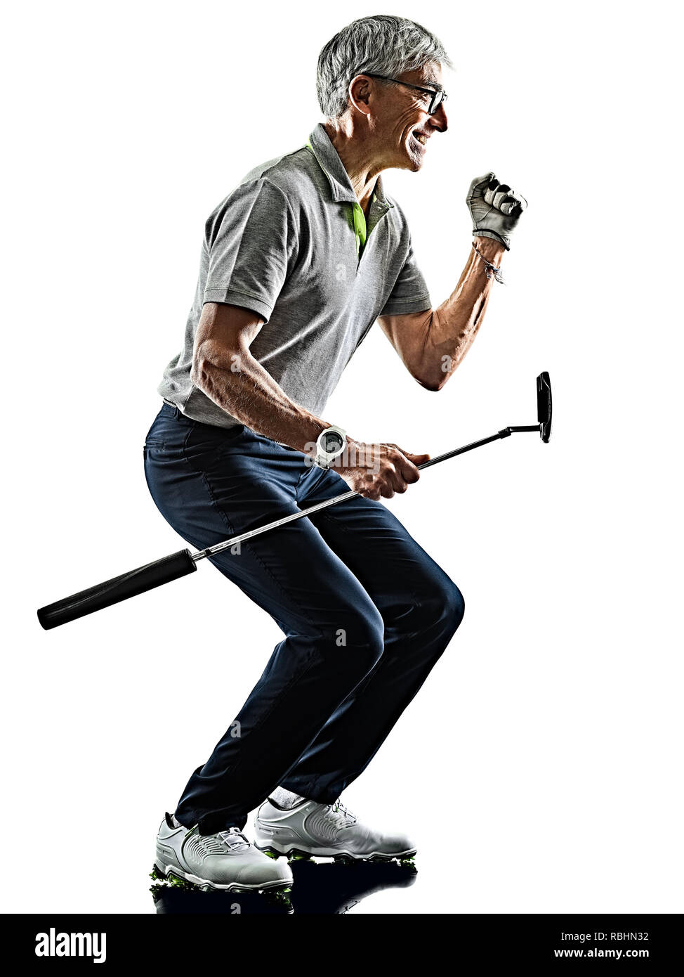 one caucasian senior man golfer golfing in studio shadow silhouette ...