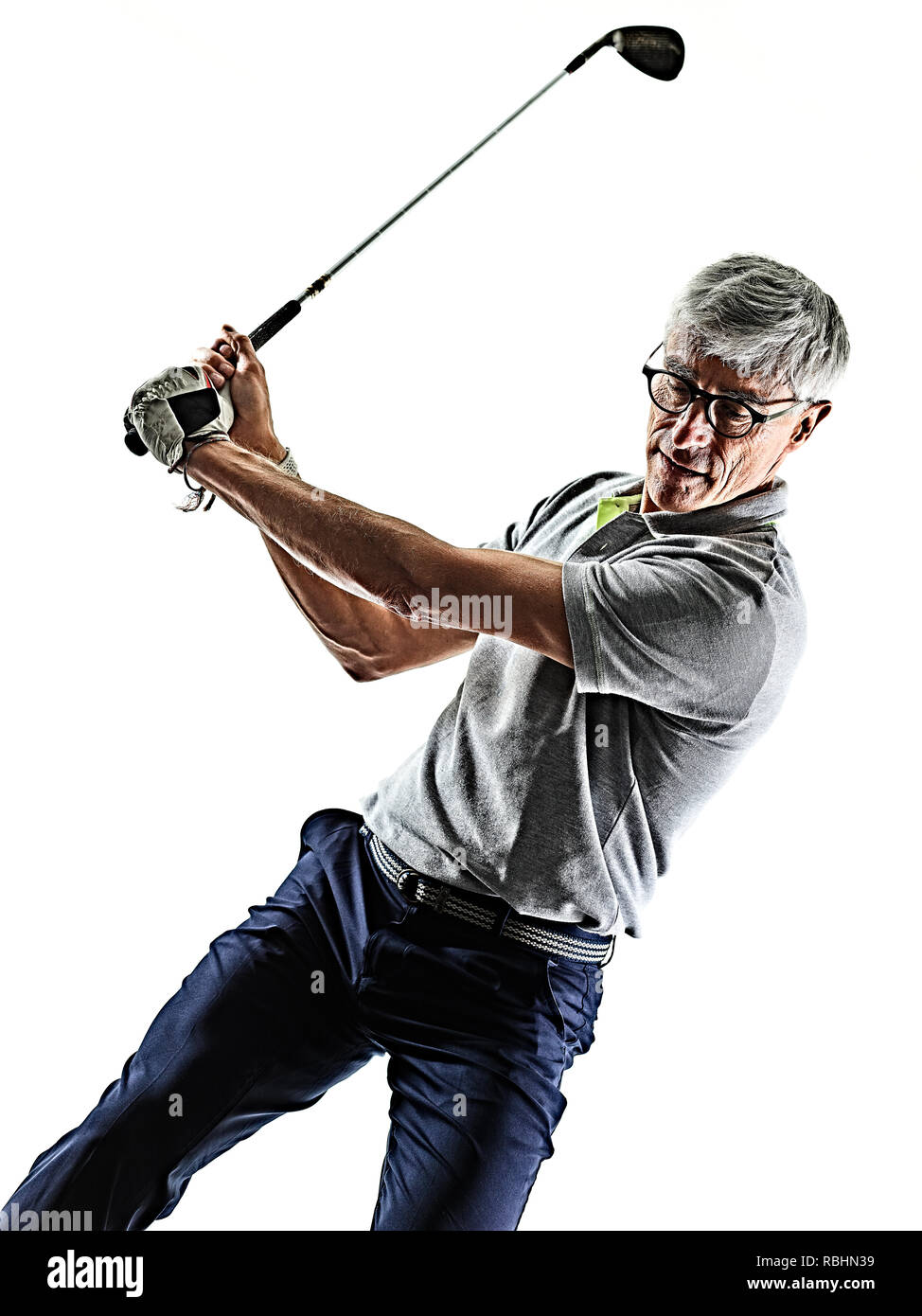 one caucasian senior man golfer golfing in studio shadow silhouette ...