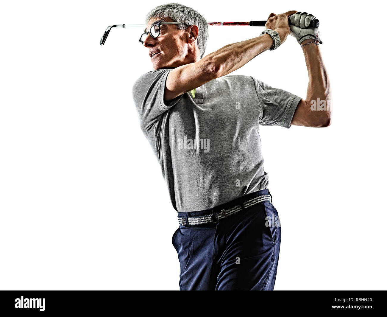 one caucasian senior man golfer golfing in studio shadow silhouette ...